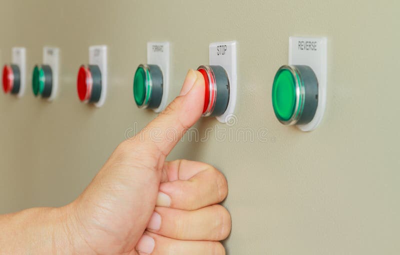 Thumb Touch on Green Start Button and Red Emergency Stop Switch Stock ...