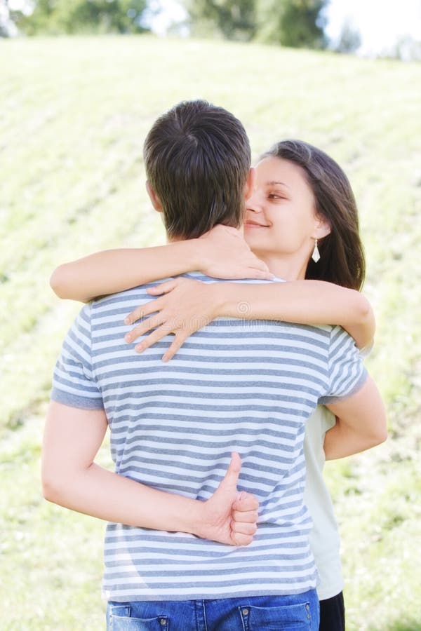 Thumb up behind back stock image. Image of okay, attractive - 12871523