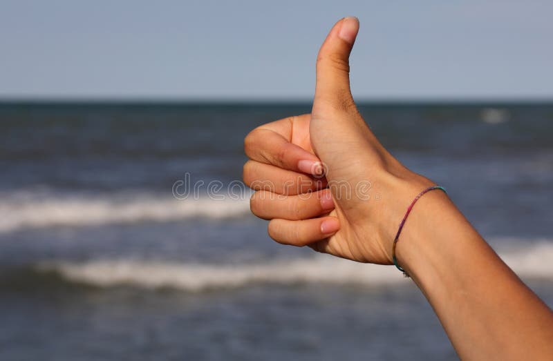 Thumb Up from the Hand of the Young Man Who Indicates Success and ...