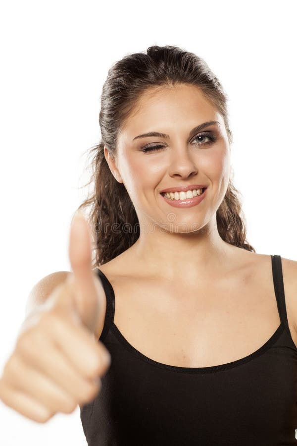 Thumb up and a wink stock image. Image of female, hand - 94793475