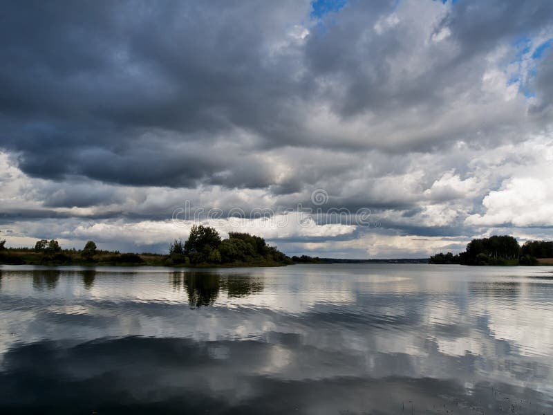 Thunder clouds over lake stock image. Image of tranquil - 21243451