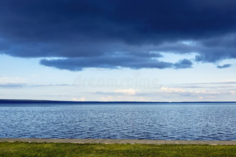 Thundercloud over lake stock image. Image of colourful - 56540295