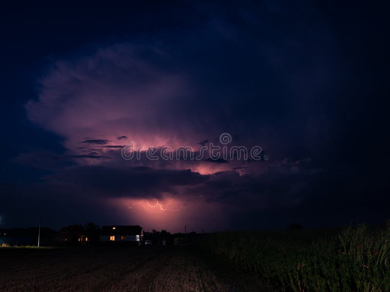 Thundercloud Over the Romanian Landscape is Illuminated by Pink ...