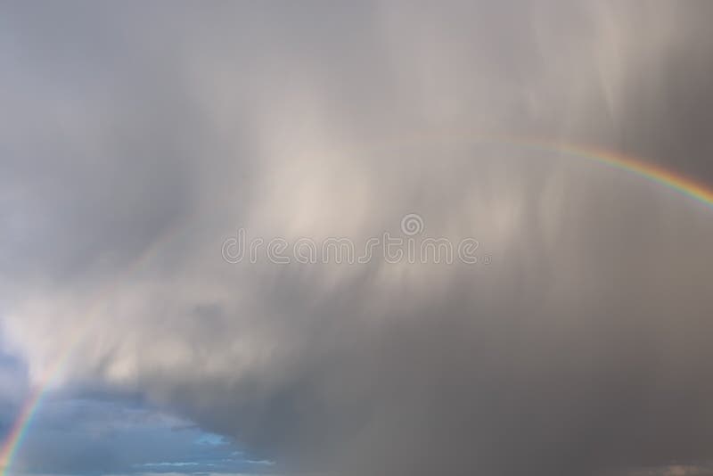 Thundercloud and Rainbow Over the City Stock Image - Image of dark ...