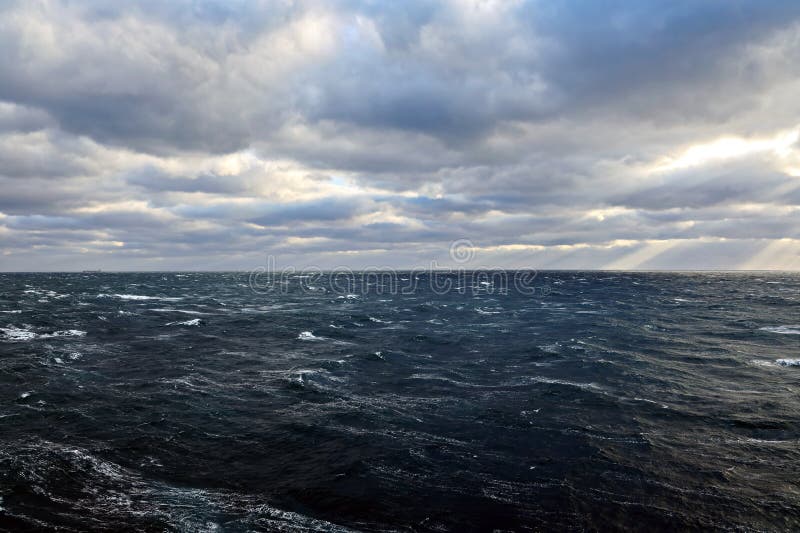 Thunderclouds and Rain Clouds Over the Sea Horizon and the Surface of ...