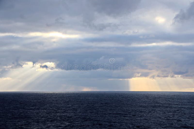 Thunderclouds and Rain Clouds Over the Sea Horizon and the Surface of ...