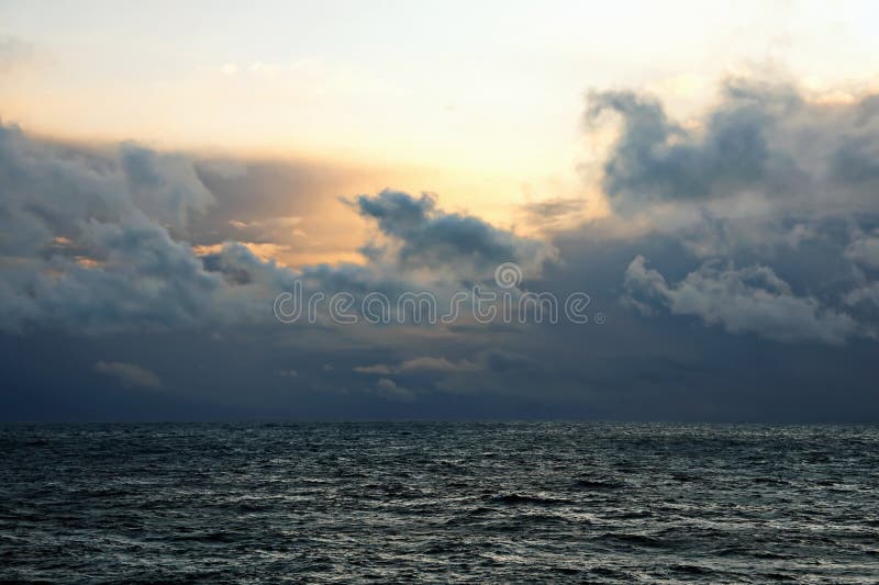 Thunderclouds And Rain Clouds Over The Sea Horizon And The Surface Of ...