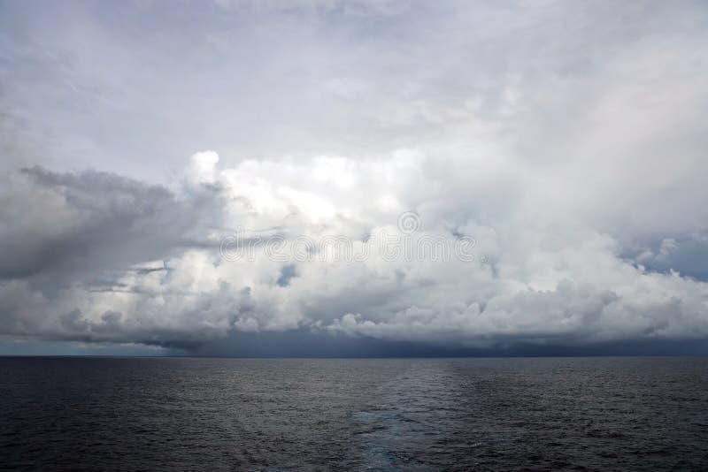 Thunderclouds and Rain Clouds Over the Sea Horizon and the Surface of ...