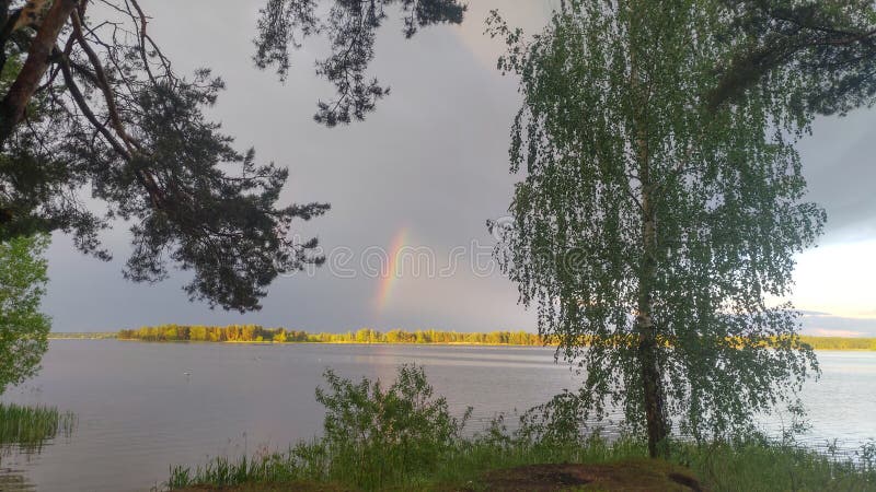 A Thunderstorm is Approaching the Lake. it is Raining Over the Far ...