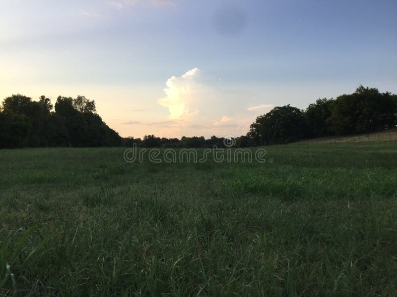 Thunderstorm Building Over a Meadow. Stock Image - Image of building ...