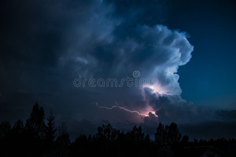 Thunderstorm Clouds with Lightning at the Evening Stock Image - Image ...