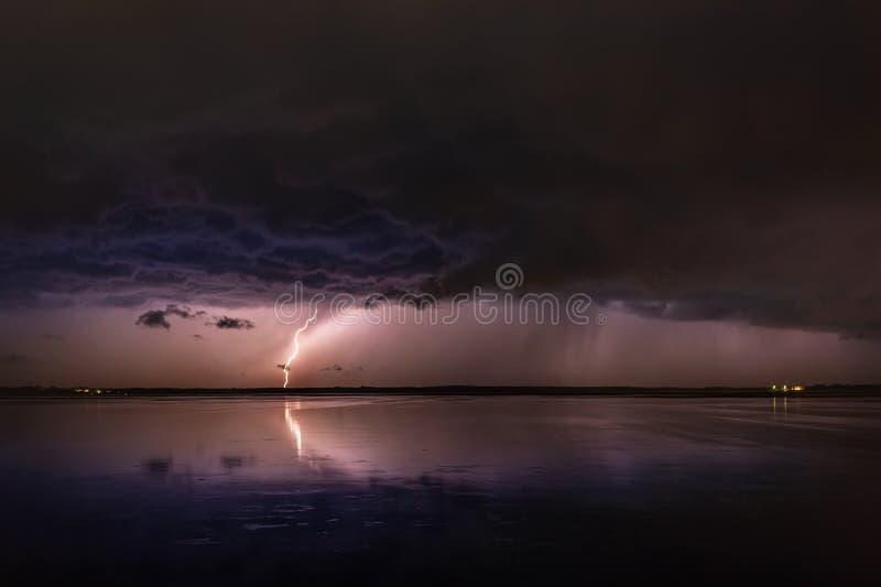 During a Thunderstorm, Lightning Strikes the Ground Stock Photo - Image ...