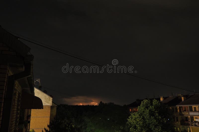 Thunderstorm at Night Over the City. Flashes of Lightning and Low ...