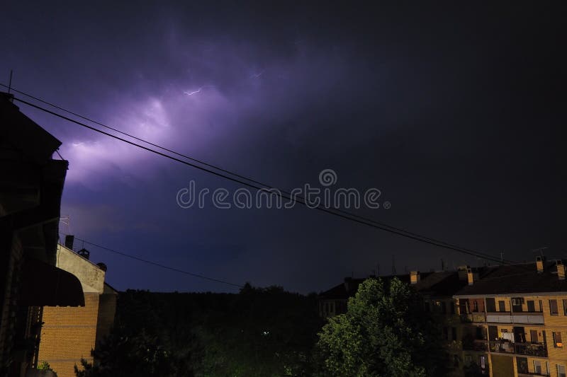 Thunderstorm at Night Over the City. Flashes of Lightning and Low ...