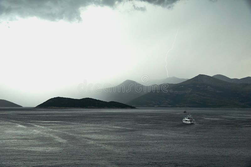 Thunderstorm at sea stock photo. Image of water, mountains - 134513778