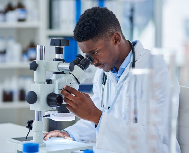 Thus is Just Remarkable. a Focused Young Male Scientist Looking at Test ...