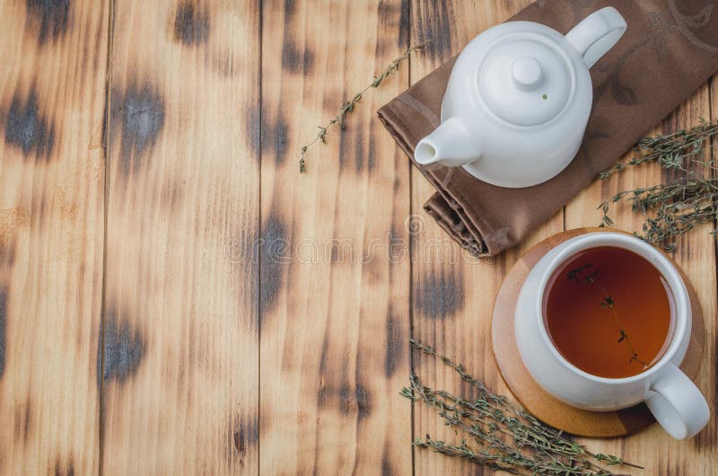 Thyme Herbal Tea, White Cup with Tea and Kettle. Top View and Copyspace ...