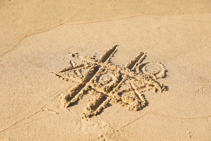 Tic Tac Toe Game Drawn on Sandy Beach Stock Image - Image of sand ...