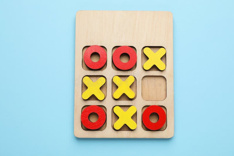 Tic Tac Toe Set on Light Blue Background, Top View Stock Image - Image ...