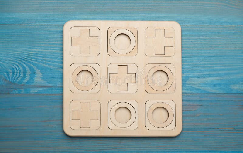 Tic Tac Toe Set on Light Blue Wooden Table, Top View Stock Image ...