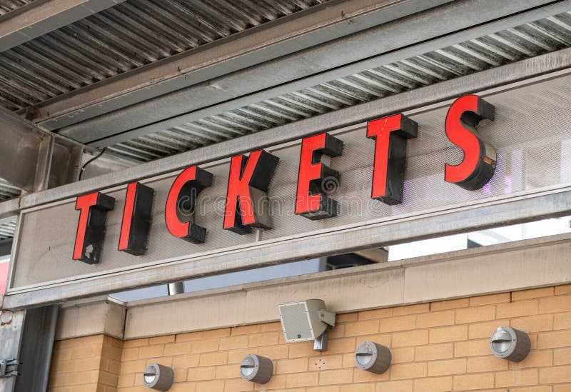 Tickets Sign in Red Letters on Building Stock Photo - Image of beige ...