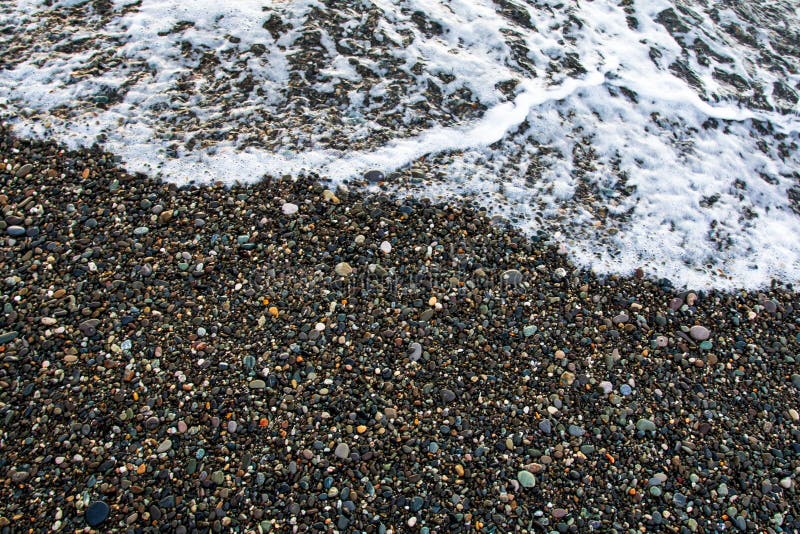 The Wave Rolls Onto the Seashore, Which is Covered with Small Stones ...