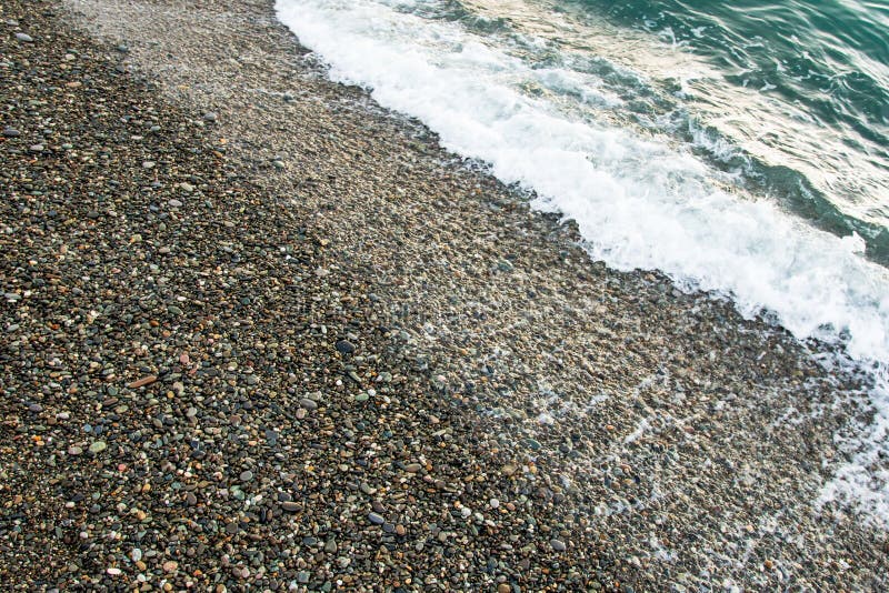 The Wave Rolls Onto the Seashore, Which is Covered with Small Stones ...