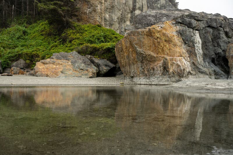 Tidal Pool at the Base of Large Rocks on the Coastal Trail at Low Tide ...