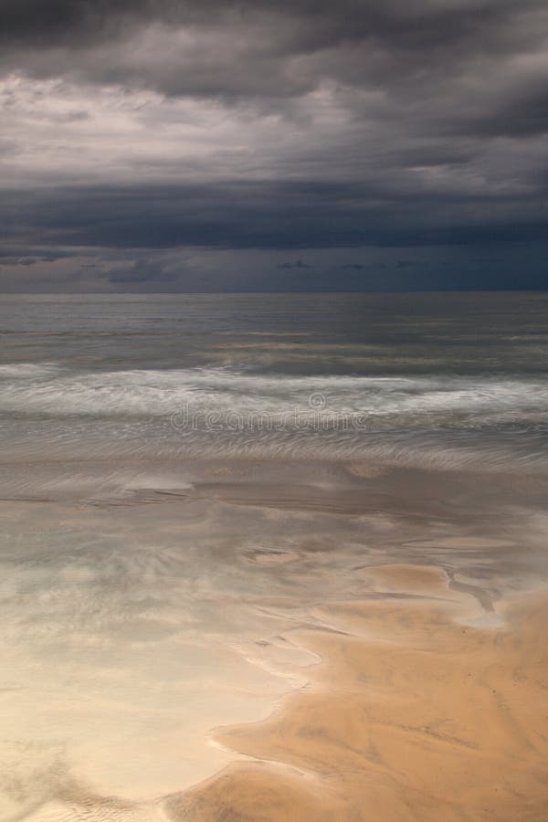 The tide is coming in fast stock photo. Image of dusk - 6071690