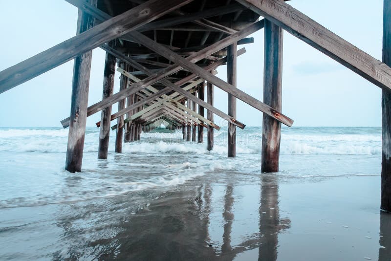 The Tide Going Back Out from Under the Pier Stock Image - Image of ...