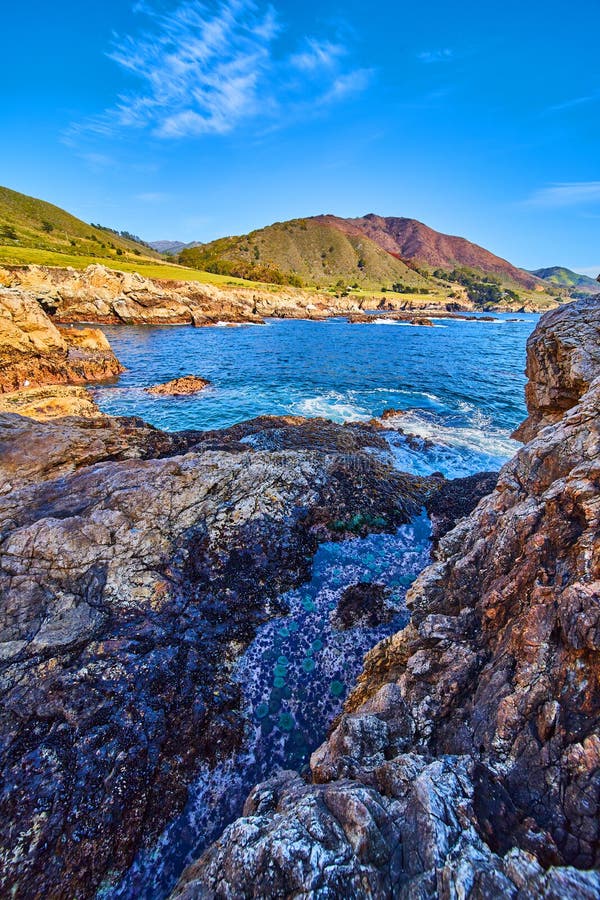 Tide Pool Hidden by Rocks and Hit by Ocean Waves Stock Photo - Image of ...