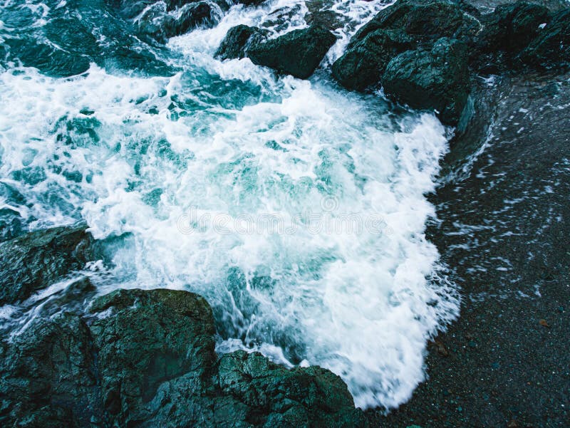 Tide wave on rocky shore. stock image. Image of tide - 227859563