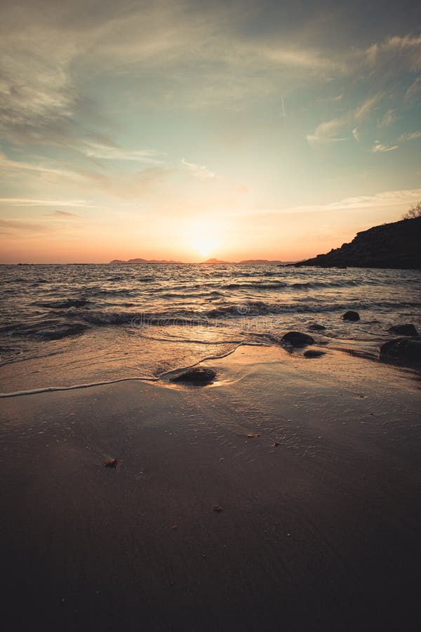 Tides Going Over the Sand of the Beach Stock Image - Image of orange ...