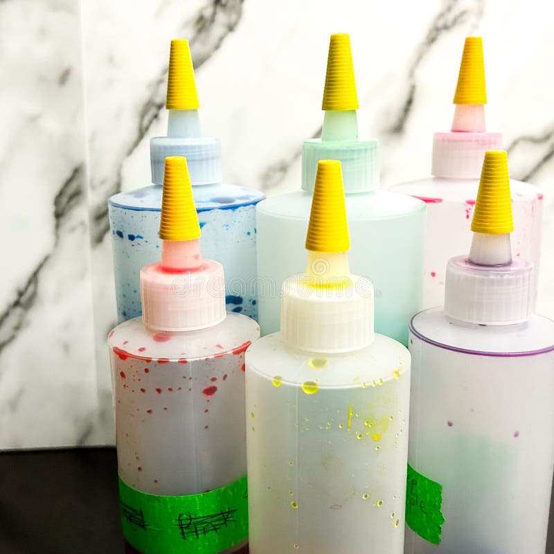 Tie Dye Paint Bottles on a White Tile Background Stock Photo - Image of ...