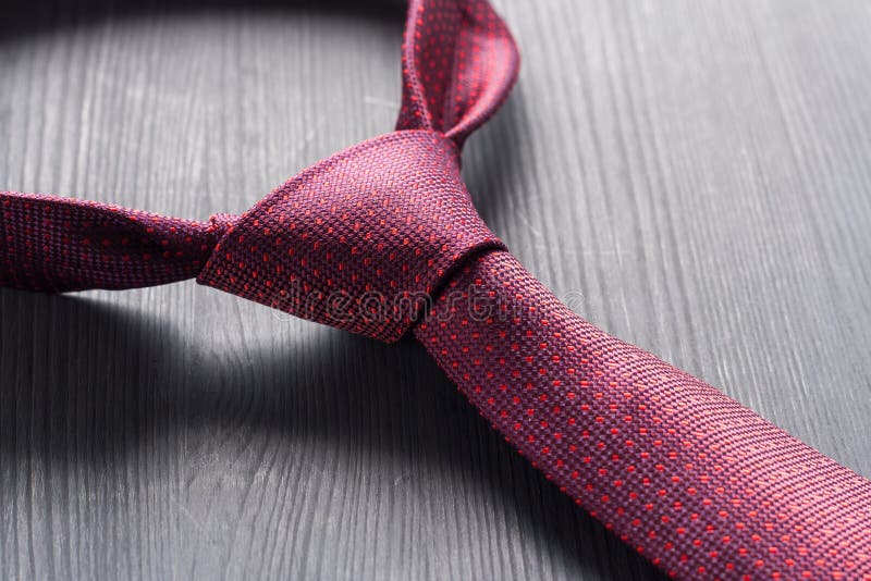 Tied Red a Tie on a Dark Table. Stock Photo - Image of patterns ...