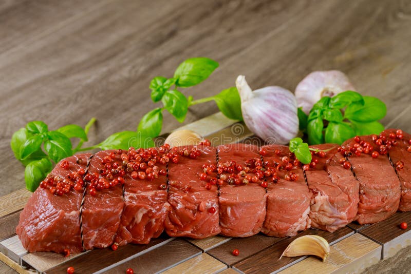 Tied Top Round Beef with Garlic and Basil Stock Image - Image of board ...