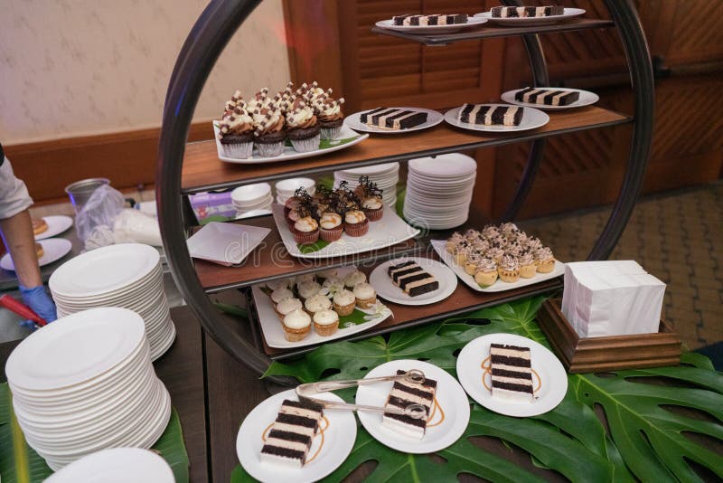 Tiered Sweets on a Beautiful Table Along with Dishes Stock Photo ...