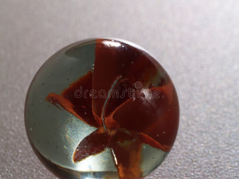 Tight Shot of a Single Marble on Gray Surface Stock Image - Image of ...