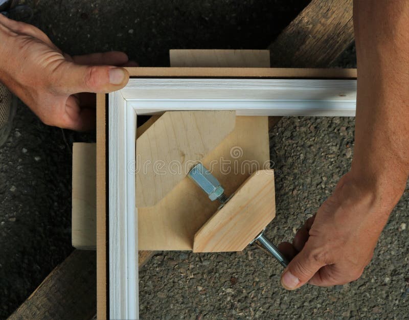 Male Hands Tighten the Door Frame Slats in a Right Angle Using a Device ...