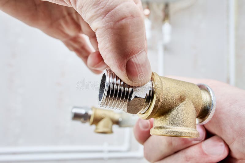Tightening Threaded Pipe Fitting Onto Brass Connector. Stock Image ...
