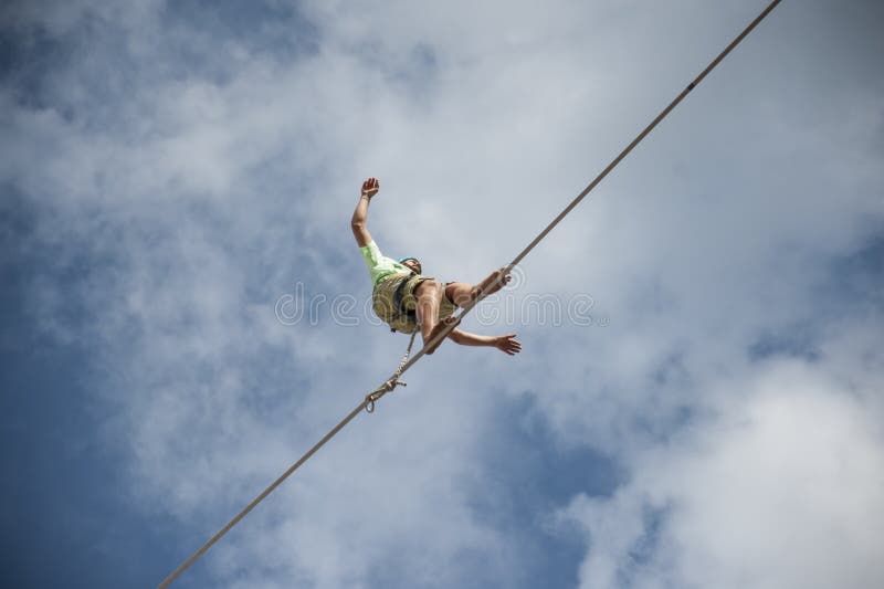 Tightrope Walker, Man Hanging on a Rope Walks in the Sky Editorial ...