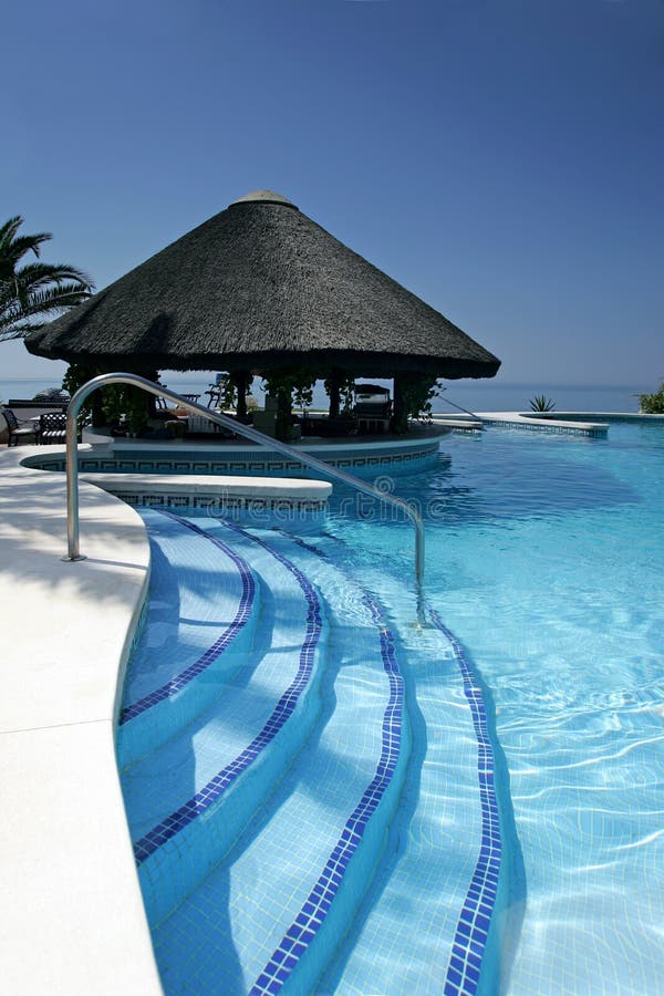 Tiki Hut and Bar by Swimming Pool of Luxury Hotel Stock Photo - Image ...