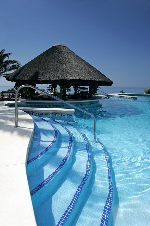 Tiki Hut and Bar by Swimming Pool of Luxury Hotel Stock Photo - Image ...