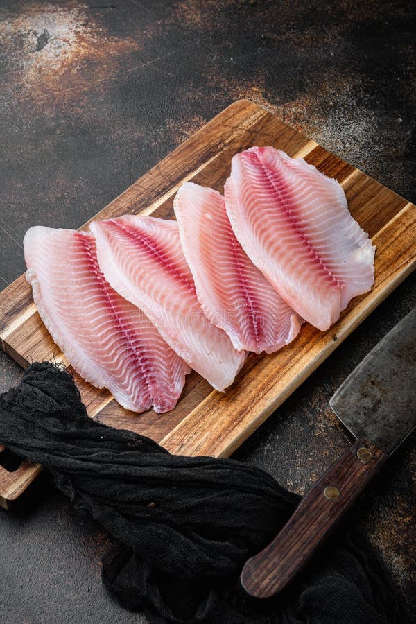 Tilapia Fish Fillet Meat, on Old Rustic Background Stock Image - Image ...