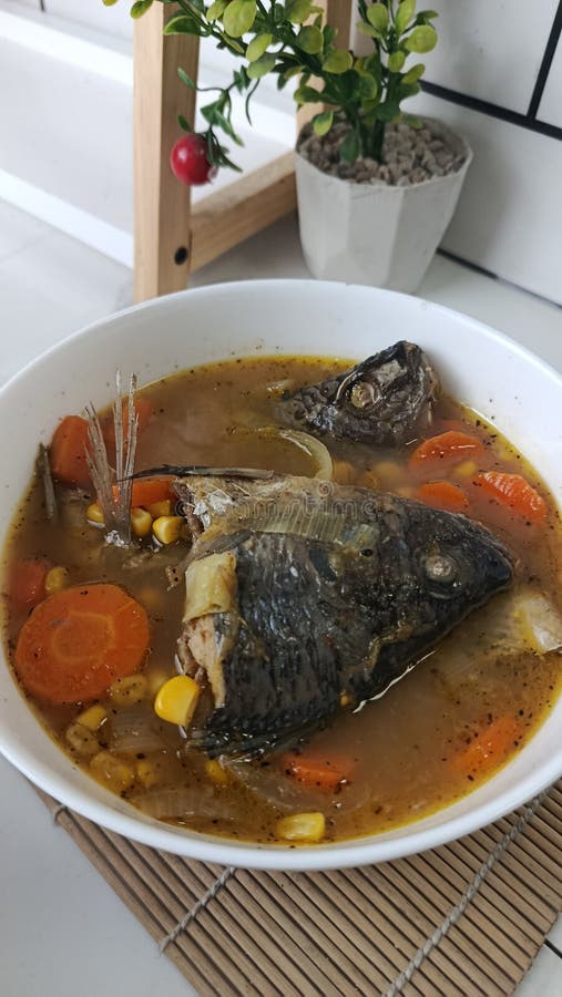 Tilapia Fish Head Soup with Delicious Vegetables Stock Photo - Image of ...