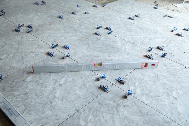 Tile Alignment System. Renovating the Floor Stock Photo - Image of ...