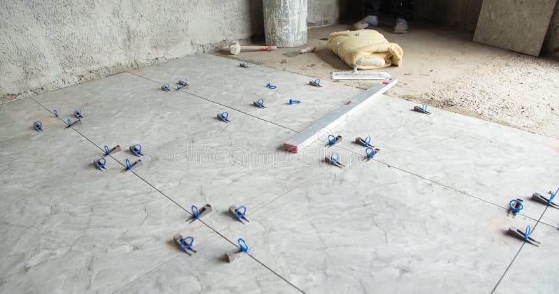 Tile Alignment System. Renovating the Floor Stock Photo - Image of work ...