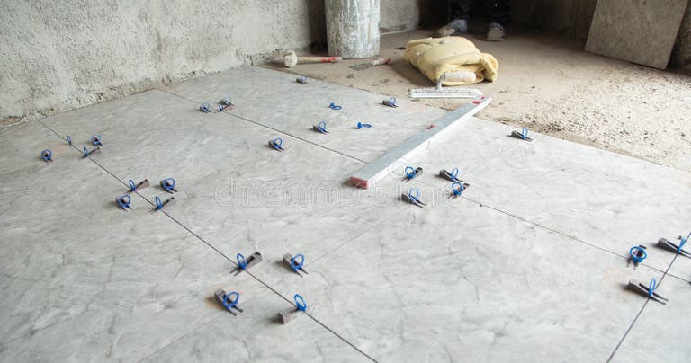 Tile Alignment System. Renovating the Floor Stock Photo - Image of work ...