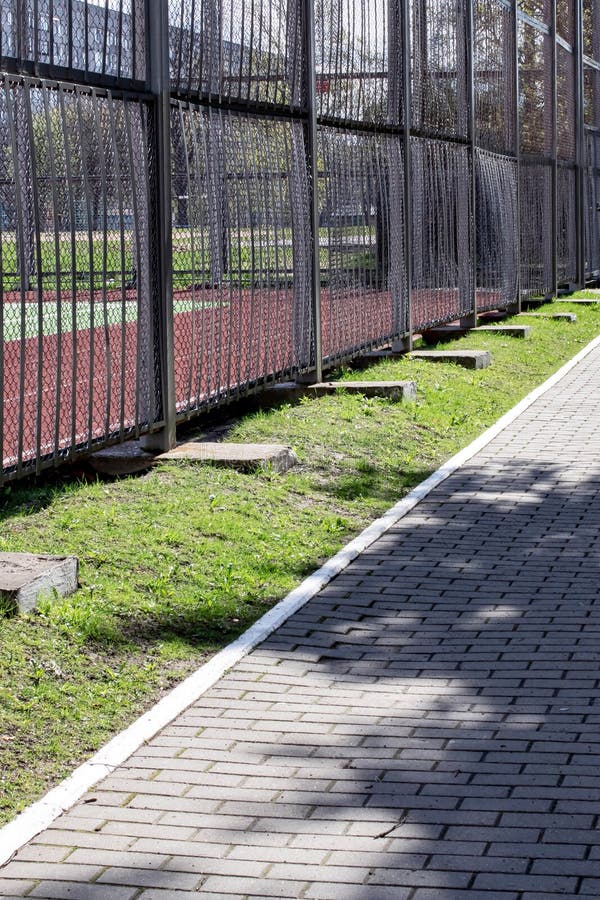 Tile Alley in the Park in Sunlight Stock Photo - Image of walkway ...