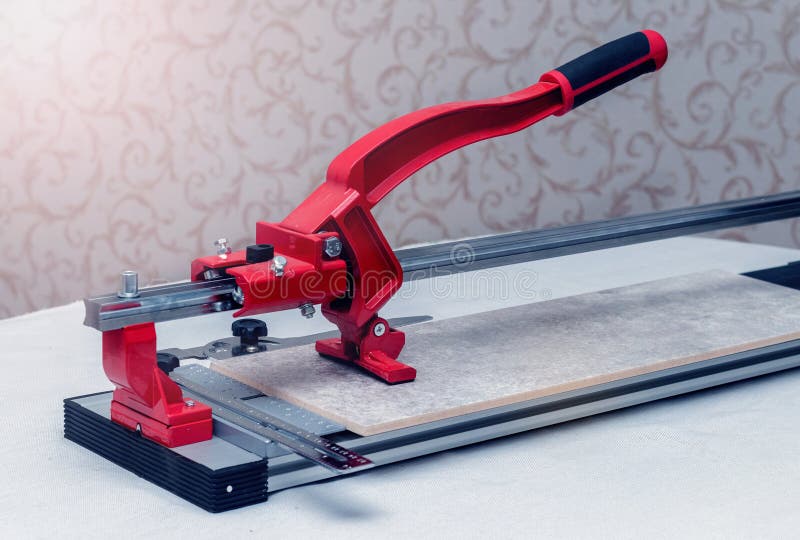 Tile Cutter and Ceramic Tile at the Master`s Workplace Stock Image ...